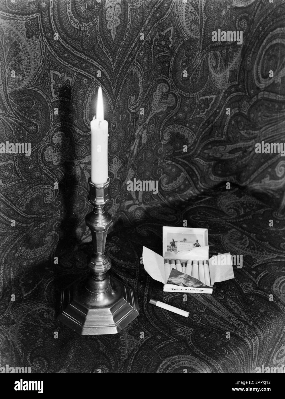 Advertising photography Still life of a candlestick with a burning ...