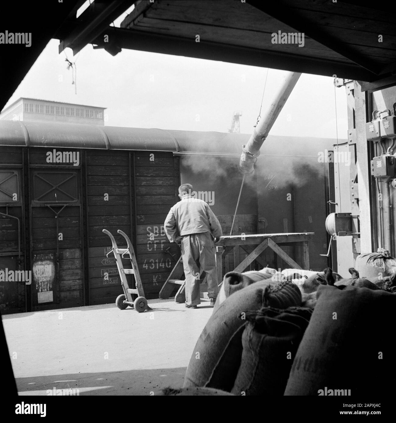 Unloading a grain ship Black and White Stock Photos & Images - Alamy