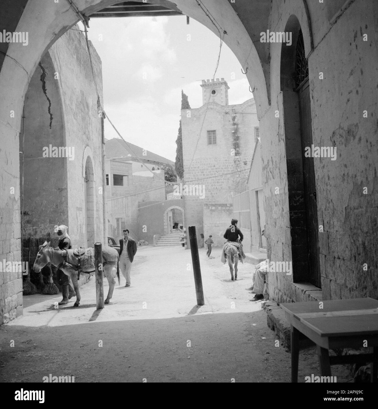 Israel: Nazareth Street with passers-by and donkeys seen from under a ...