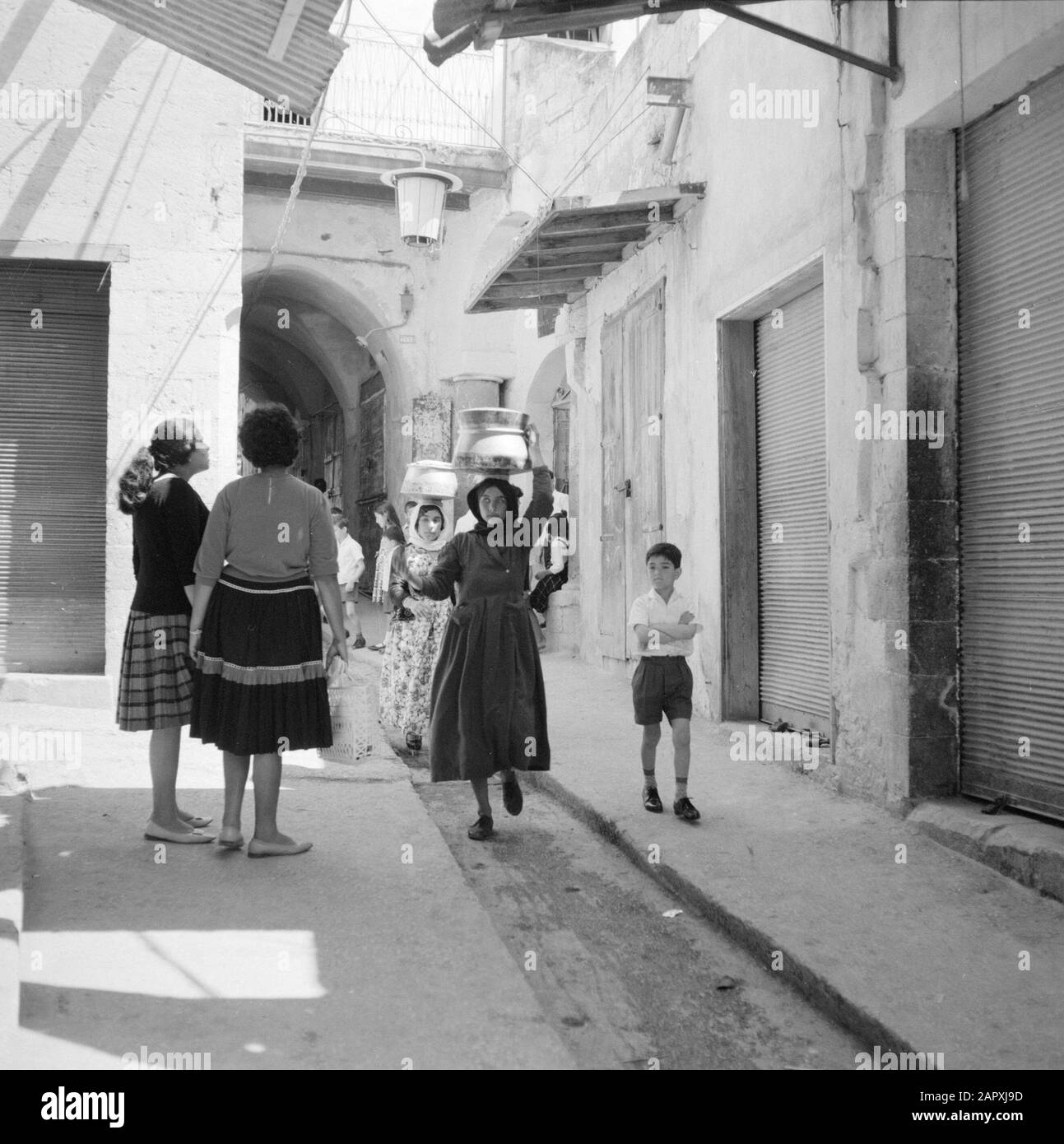 Israel: Nazareth Street with women with barrels on the head and ...