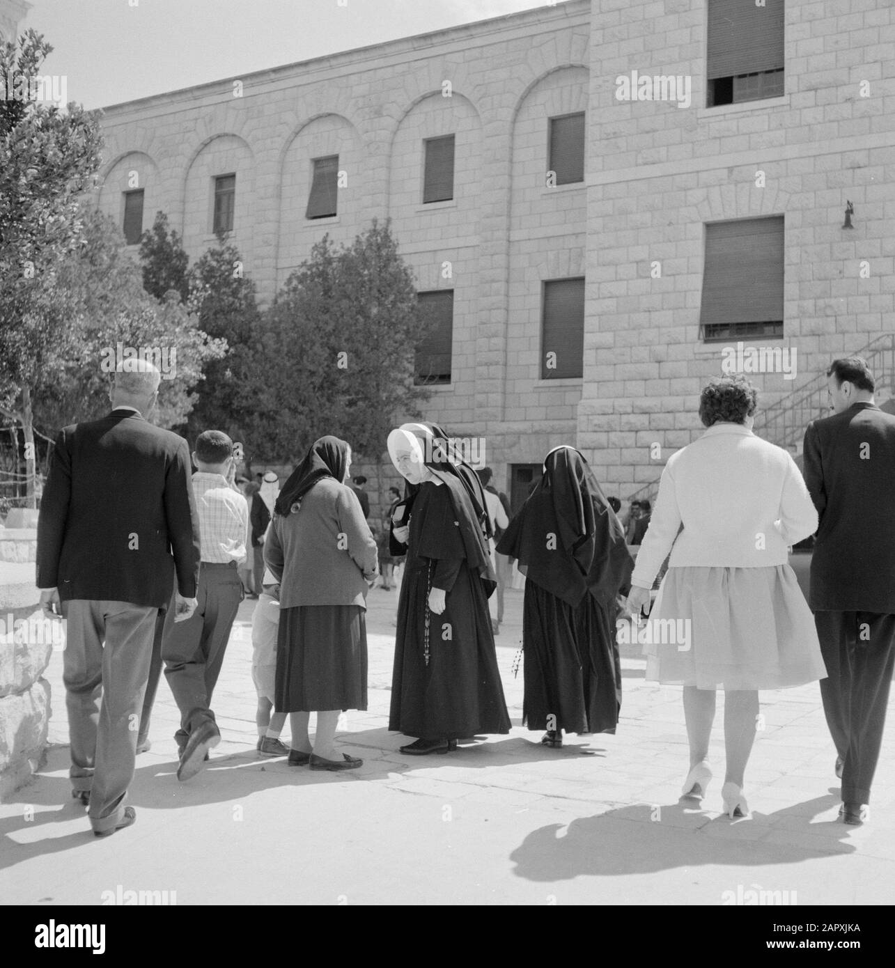 Israel: Nazareth Street statue with nuns and passers-by Date: undated ...