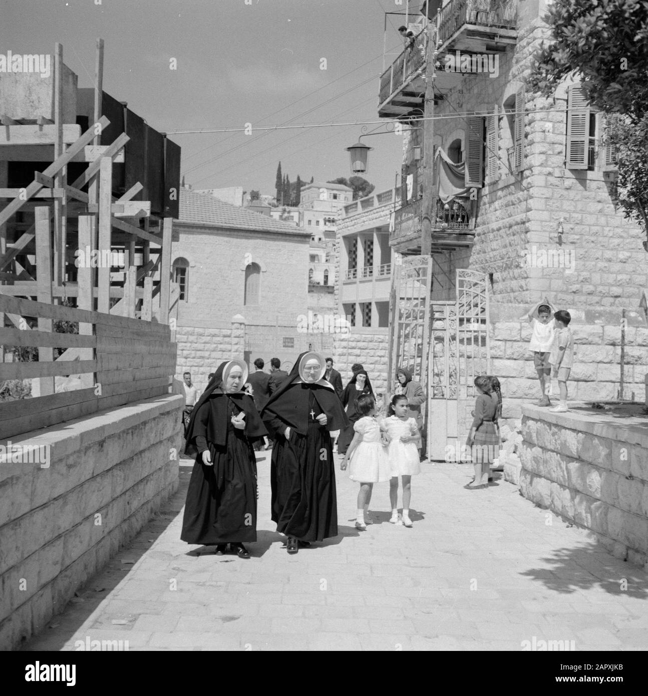 Israel: Nazareth Street statue with walking nuns and children Date ...