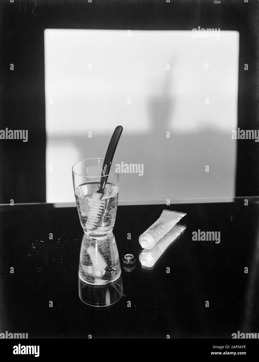 Toothbrush and toothpaste water Black and White Stock Photos & Images ...