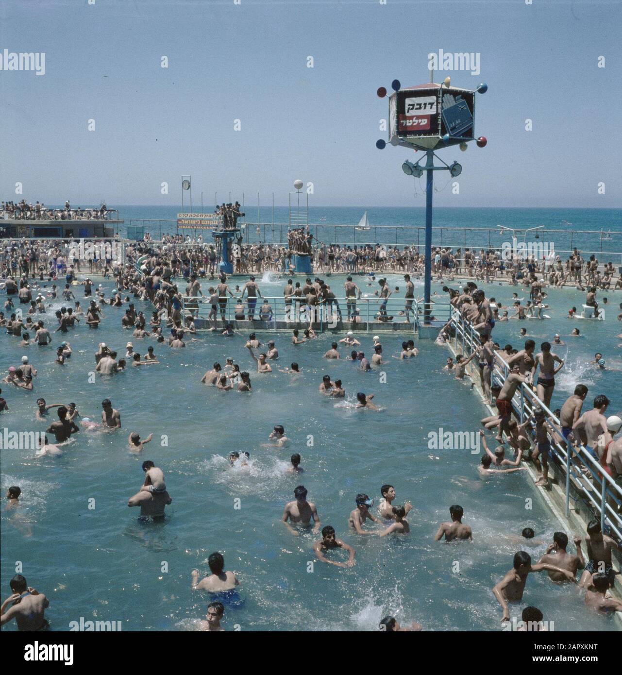 Tel Aviv. The overcrowded outdoor pool on the boulevard, containing a ...