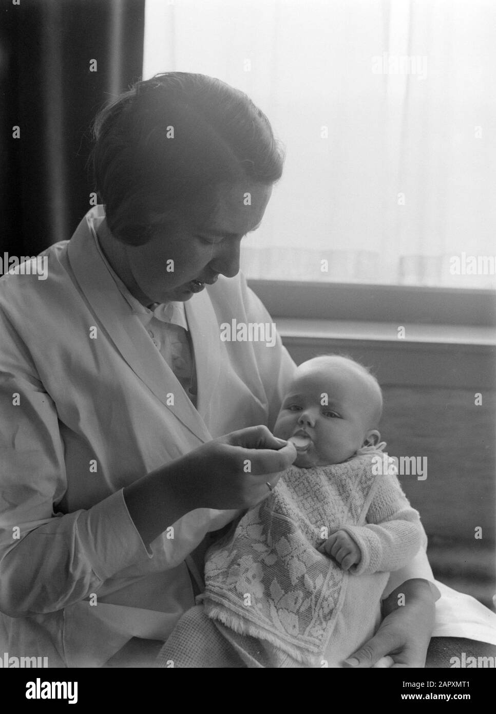 Titia performs her little daughter Agnes porridge Date: 1934 Keywords ...