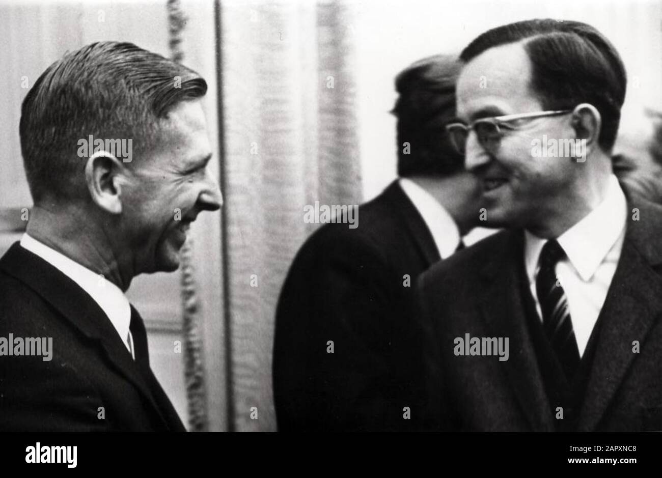 W. den Toom (VVD), Minister of Defence (with glasses) in conversation ...