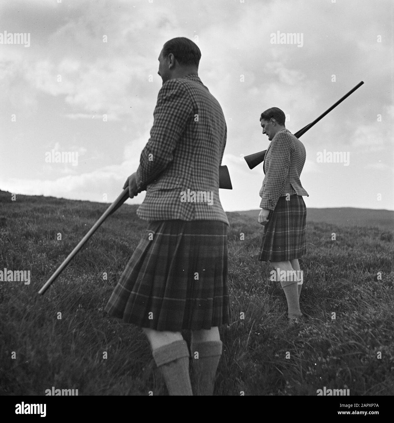 Grouse hunting on Skye Two hunters with their shotguns on the island of ...