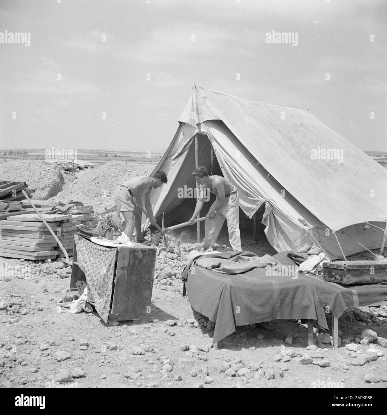 Israel 1948-1949: Negev Desert, kibbutz Revivim Two men at work for a ...