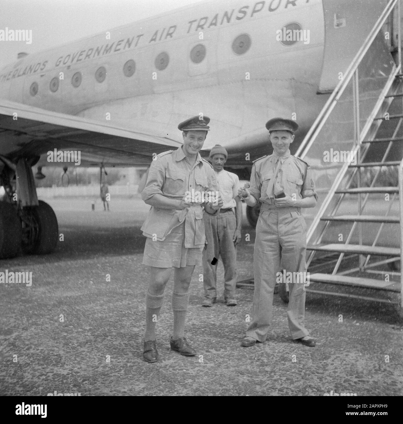 War volunteers in Malacca and Indonesia Two soldiers at an airport in ...