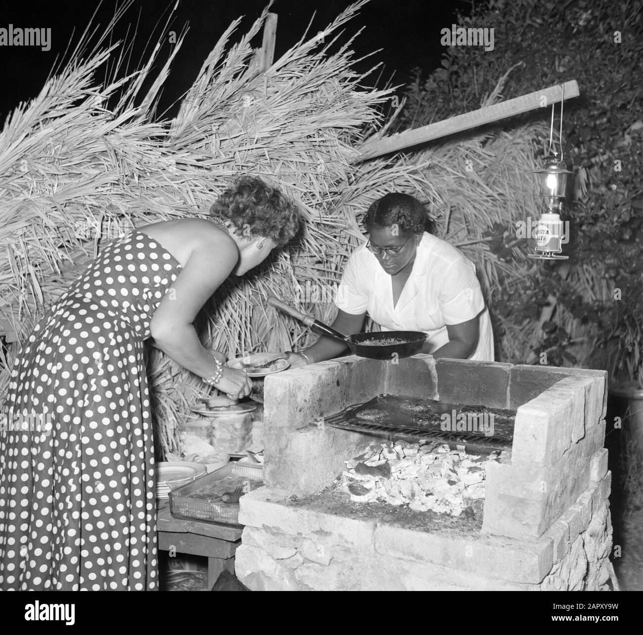 Outdoor cooking party Black and White Stock Photos & Images - Alamy