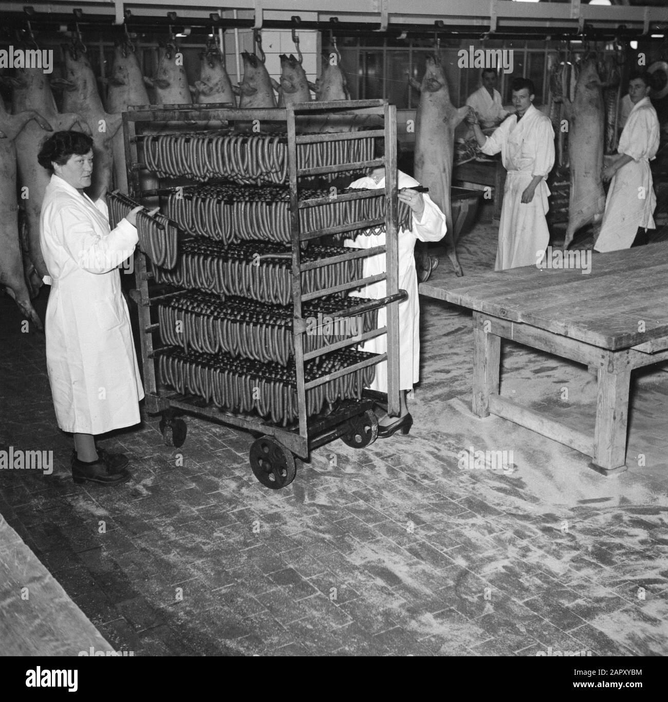 Woman at butchers Black and White Stock Photos & Images - Alamy