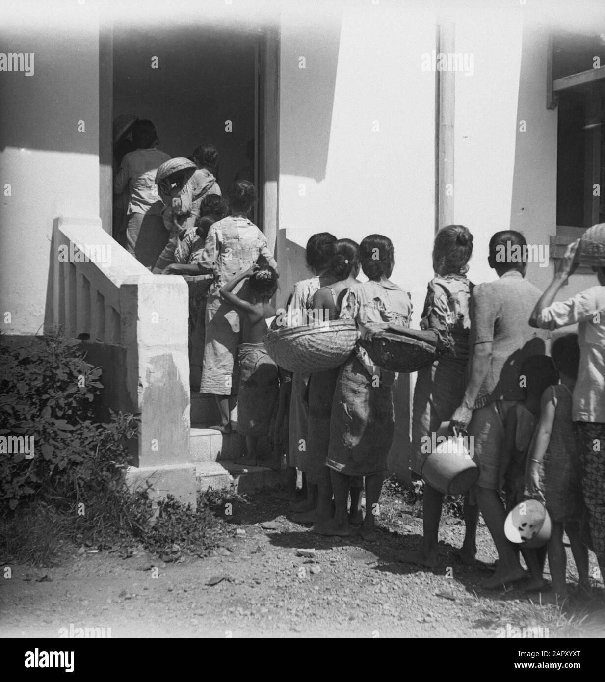 House women stand Black and White Stock Photos & Images - Alamy