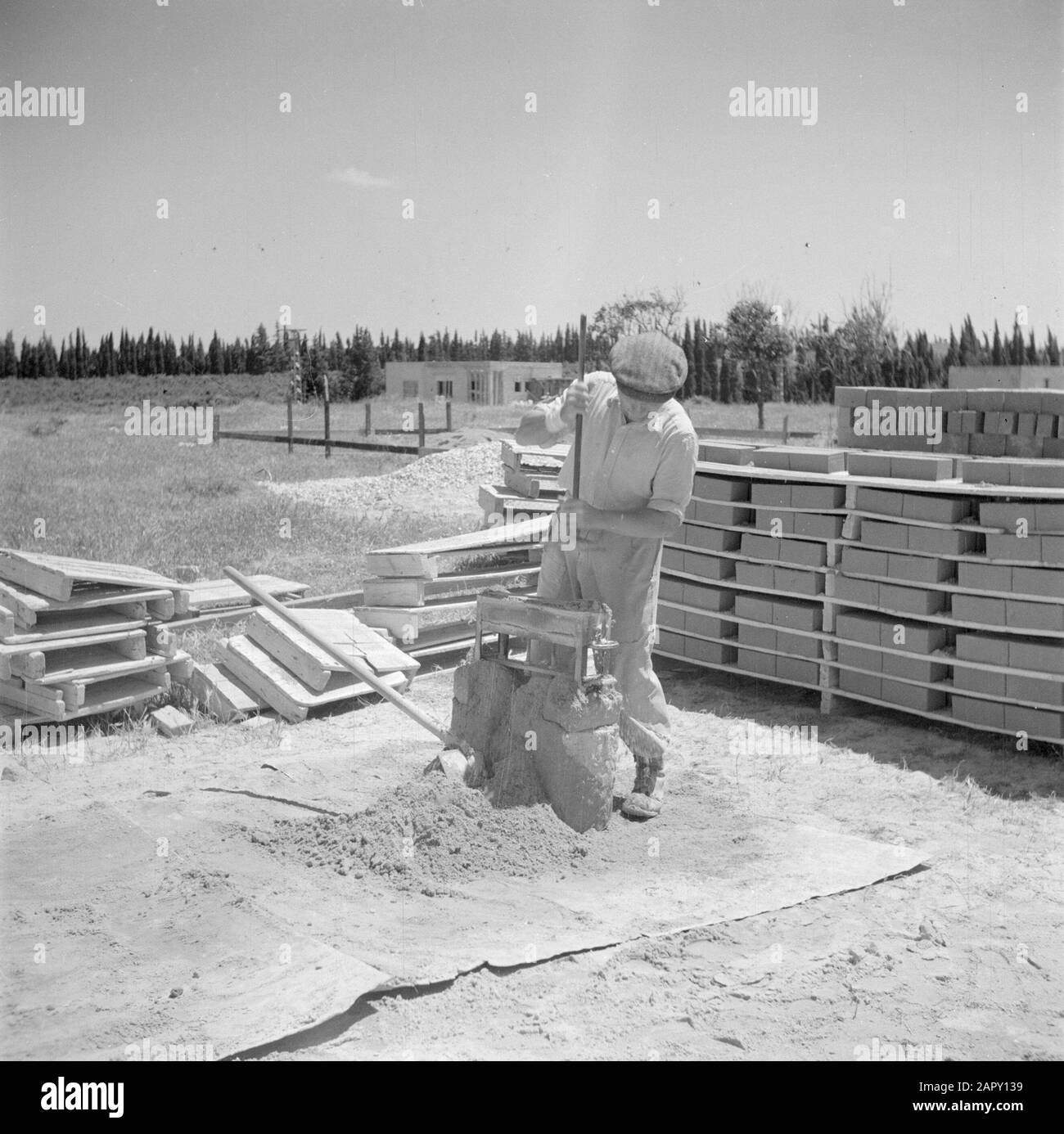 Workers in building materials Black and White Stock Photos & Images - Alamy
