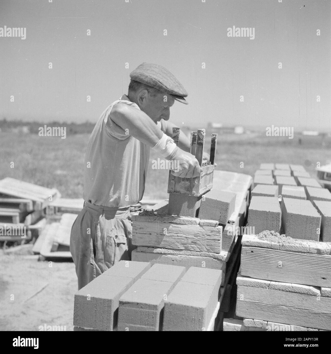 Israel 1948-1949 Employee of a brick factory at work on stacking newly ...