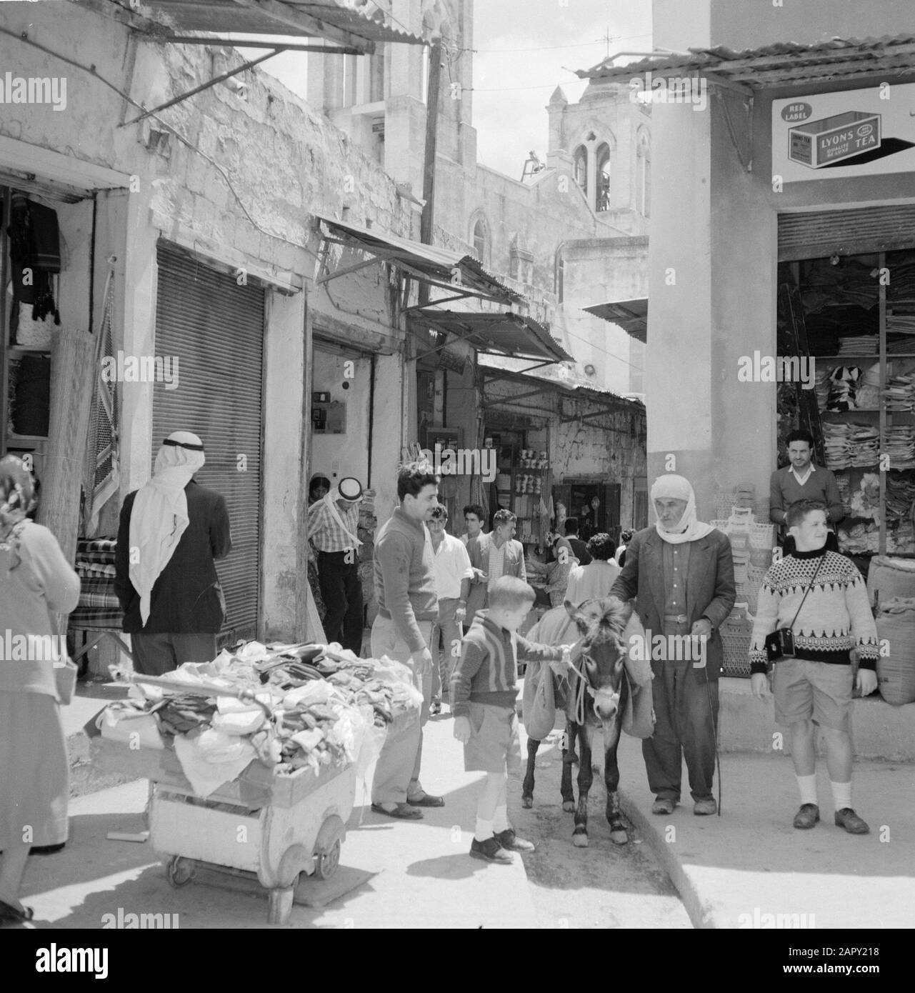 Israel: Nazareth Shopping street with passers-by, loaded carts and a ...