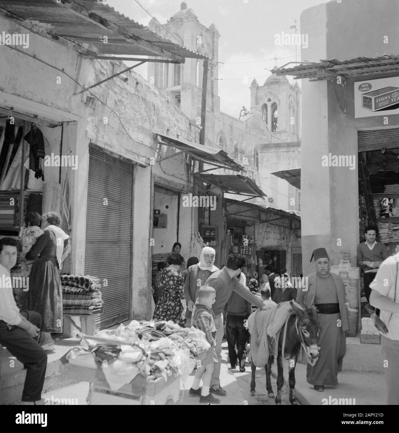 Israel: Nazareth Shopping street with passers-by, loaded carts and a ...