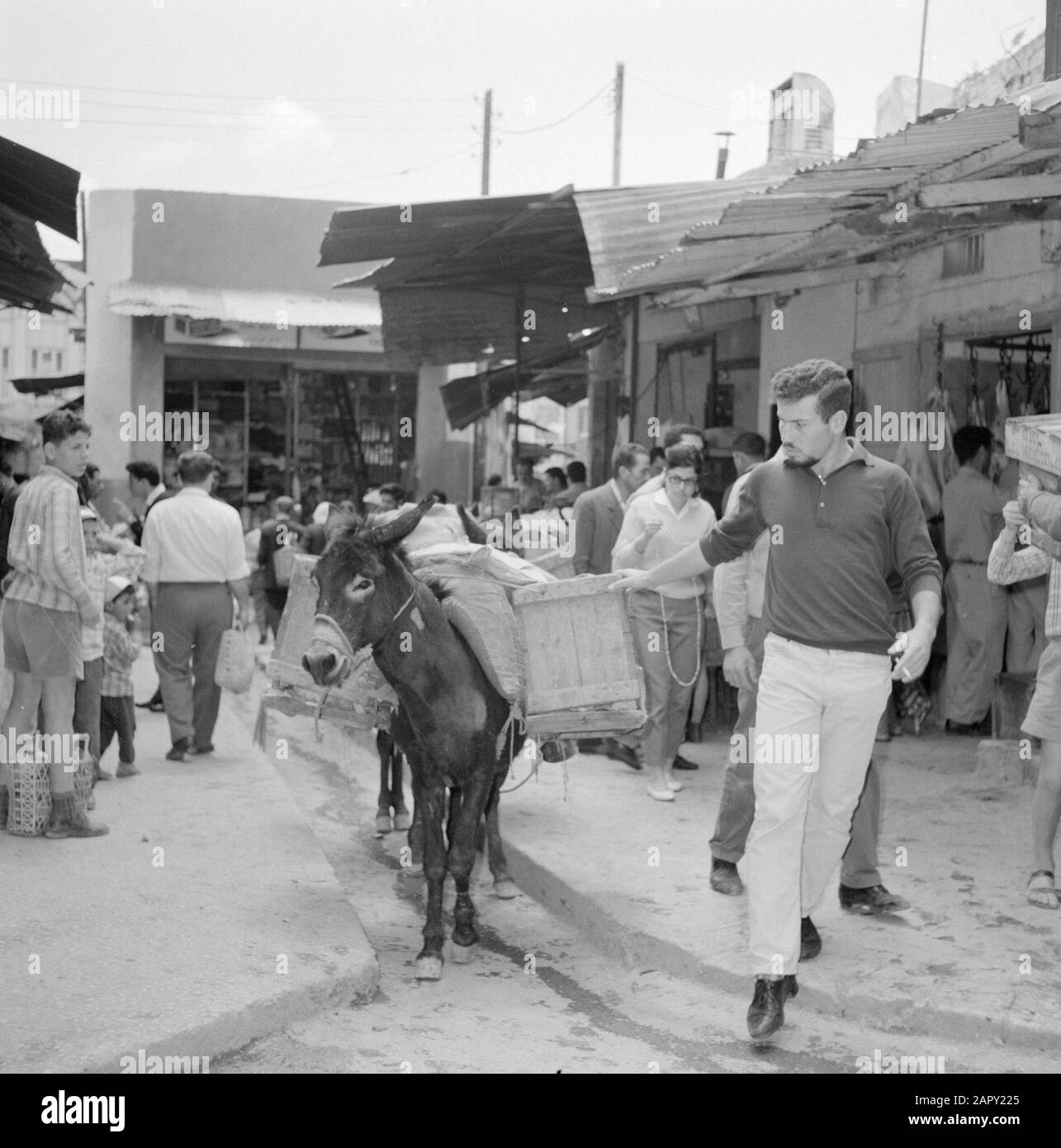 Israel: Nazareth Shopping street with shoppers and loaded donkey Date ...