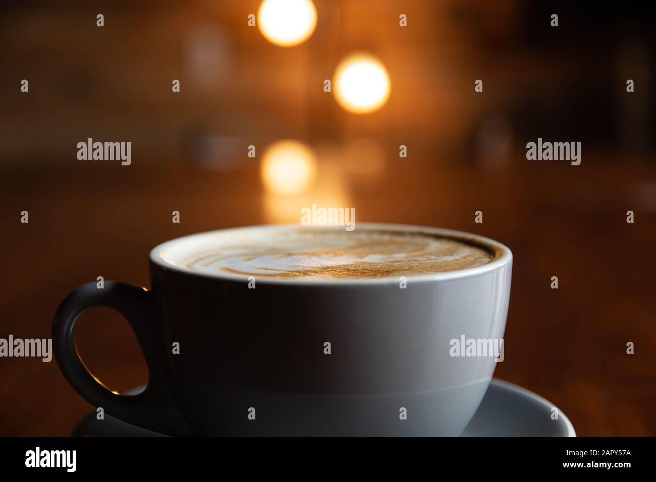 Single Coffee mug with spiraling creamer. Side/Front view Stock Photo ...