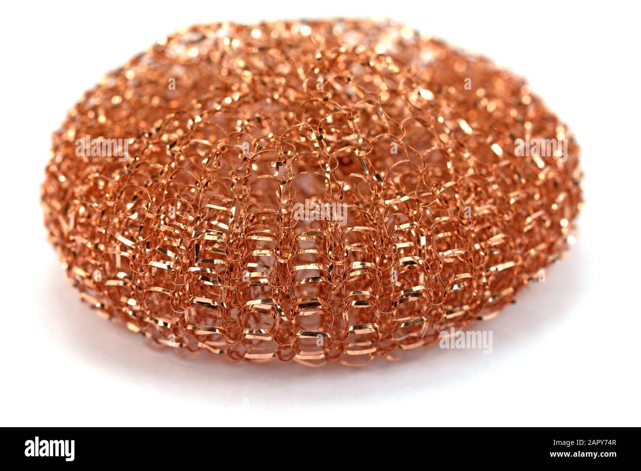 Copper scourer against white background Stock Photo - Alamy
