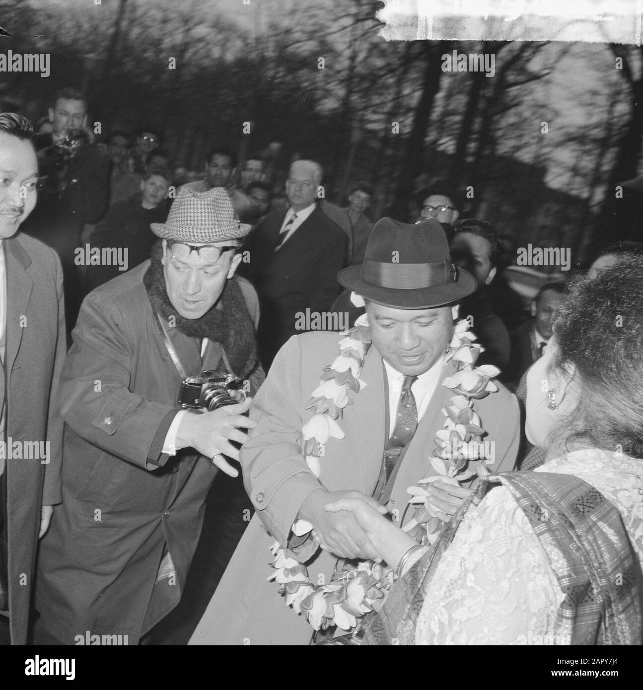 Dr. Mohammed Sharif in our country. Sharif with wreath of red and white ...