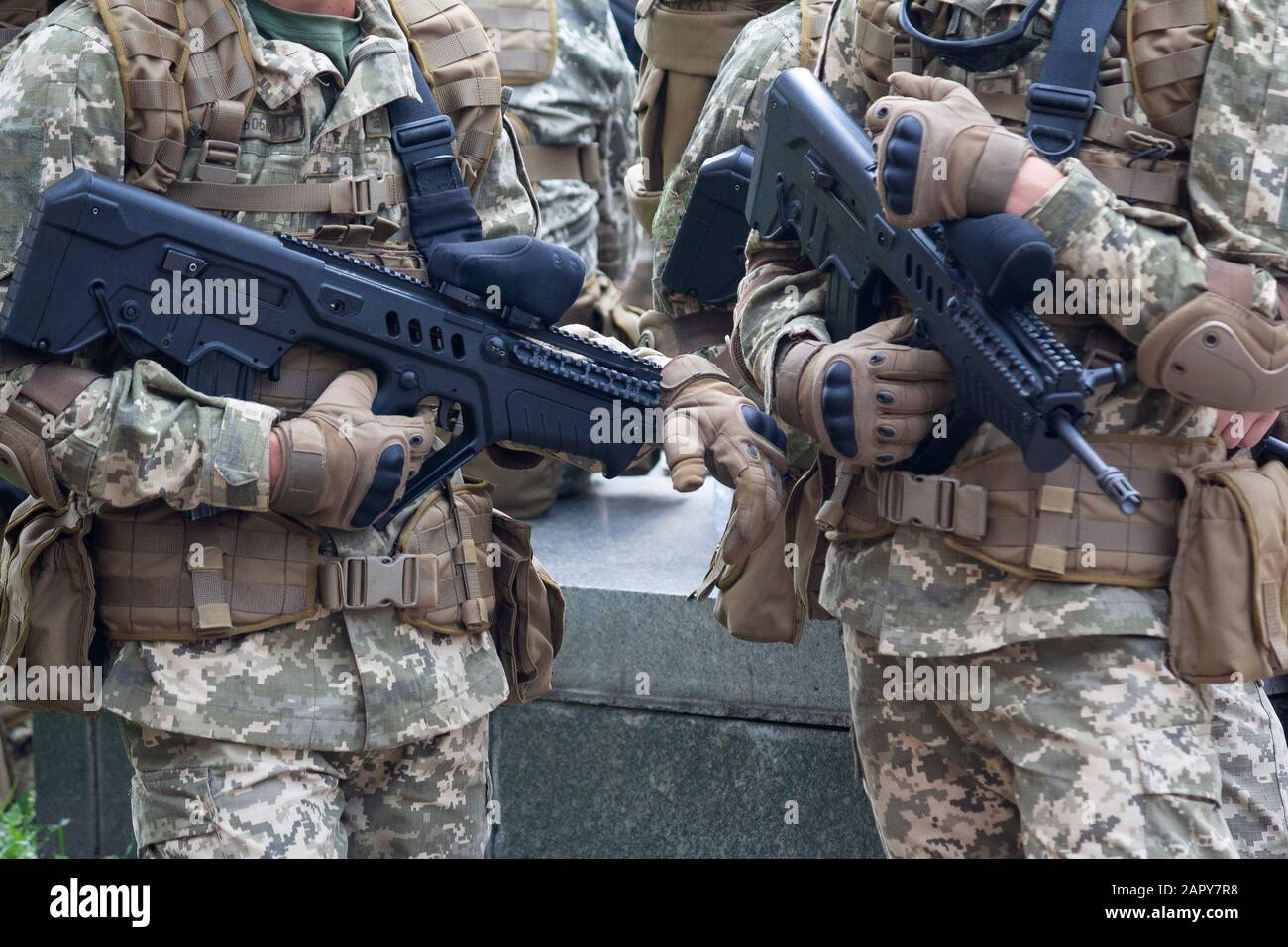 Automatic rifles in the hands of soldiers close up. Weaponry Stock ...