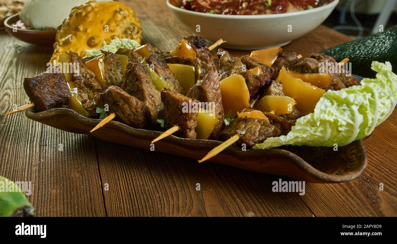 Mshikaki, street food dish , skewered pieces of marinated meat such as ...
