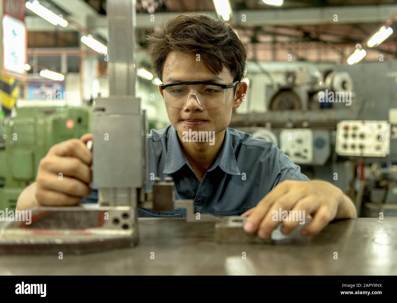 Inspection machining part and check by high gauge Stock Photo - Alamy