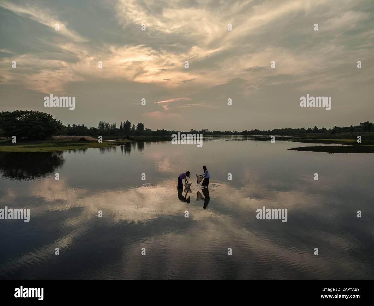 Young asian woman holding fishing hi-res stock photography and images ...