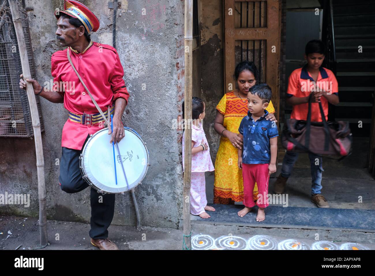 An Indian wedding or festival drummer during a band break standing ...
