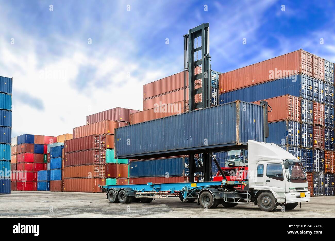 Containers at the Docks with Truck Stock Photo - Alamy