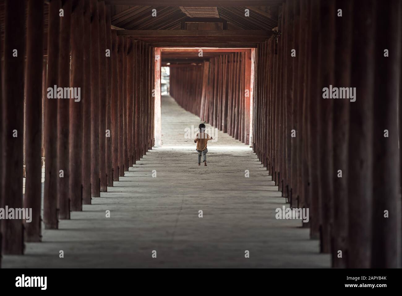 Kid walking alone Stock Photo - Alamy
