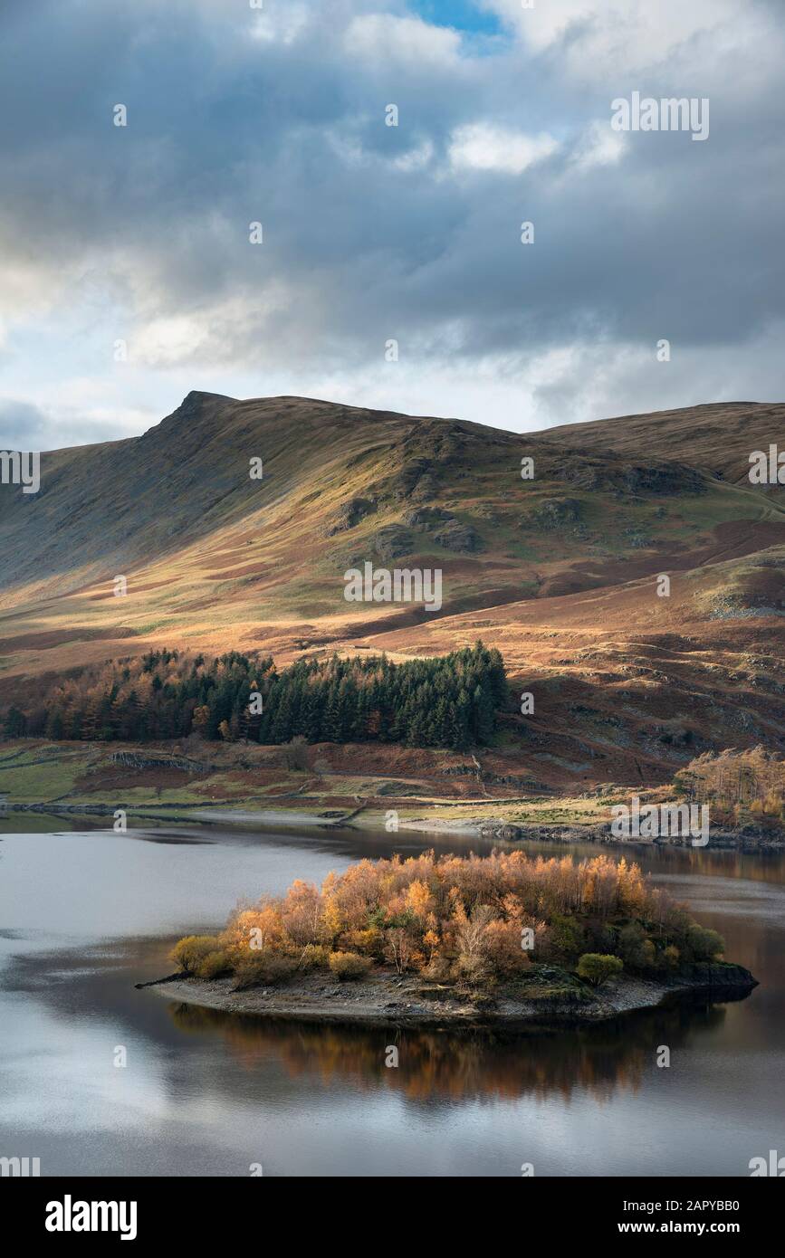 Epic Autumn Fall landscape of Hawes Water with epic lighting and ...
