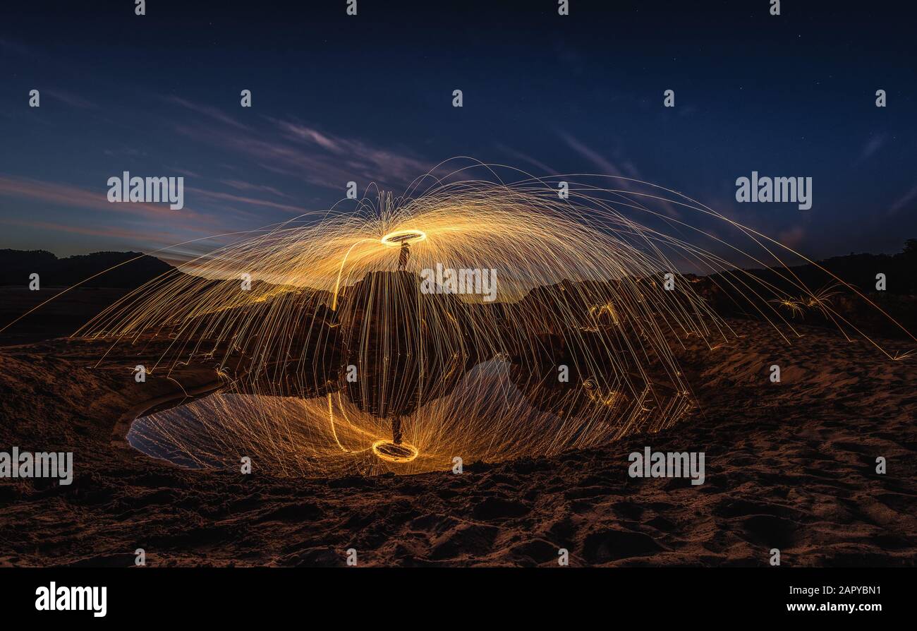 Fire show amazing at twilight Stock Photo - Alamy