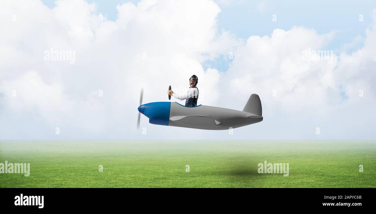 Happy aviator driving small propeller plane Stock Photo - Alamy