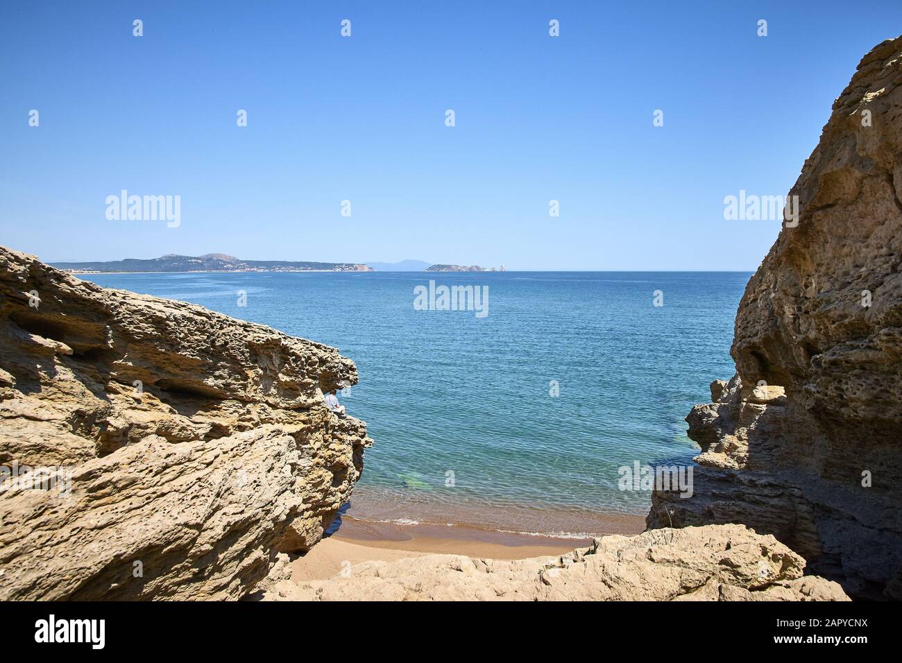 Rocks on the shore of the sea at the Playa Illa Roja public beach in ...