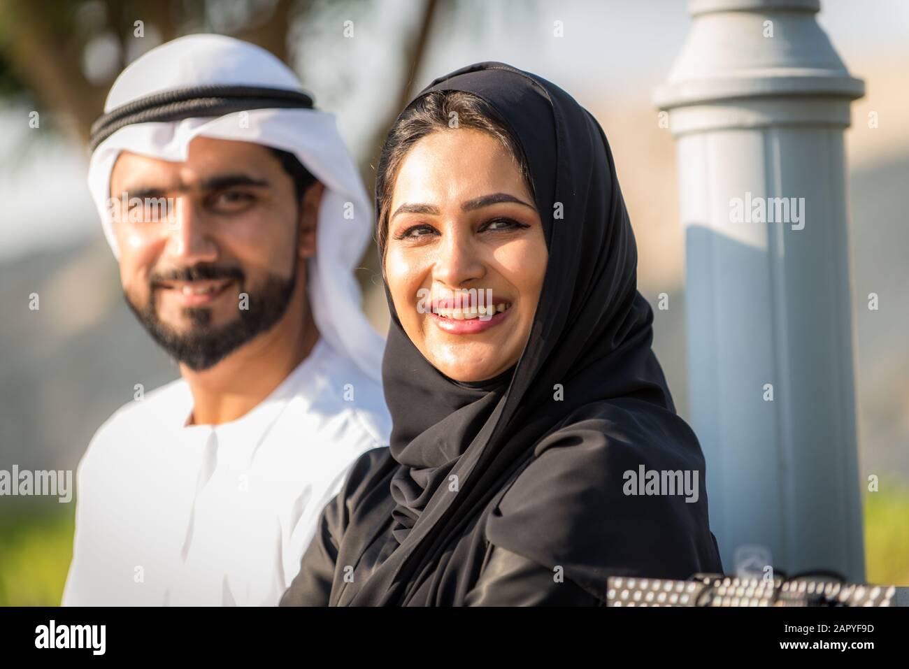 Beautiful middle eastern couple dating outdoors in Dubai - Married pair ...