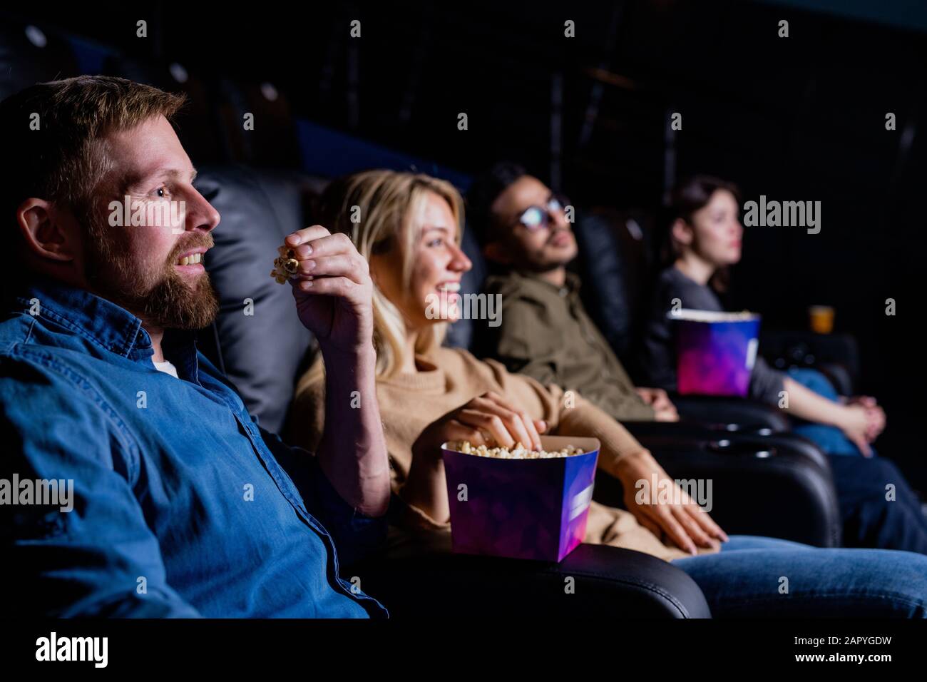 Row people watching film cinema hi-res stock photography and images - Alamy