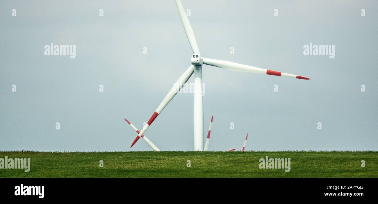 Wind fan standing on a green landscape during daytime Stock Photo - Alamy