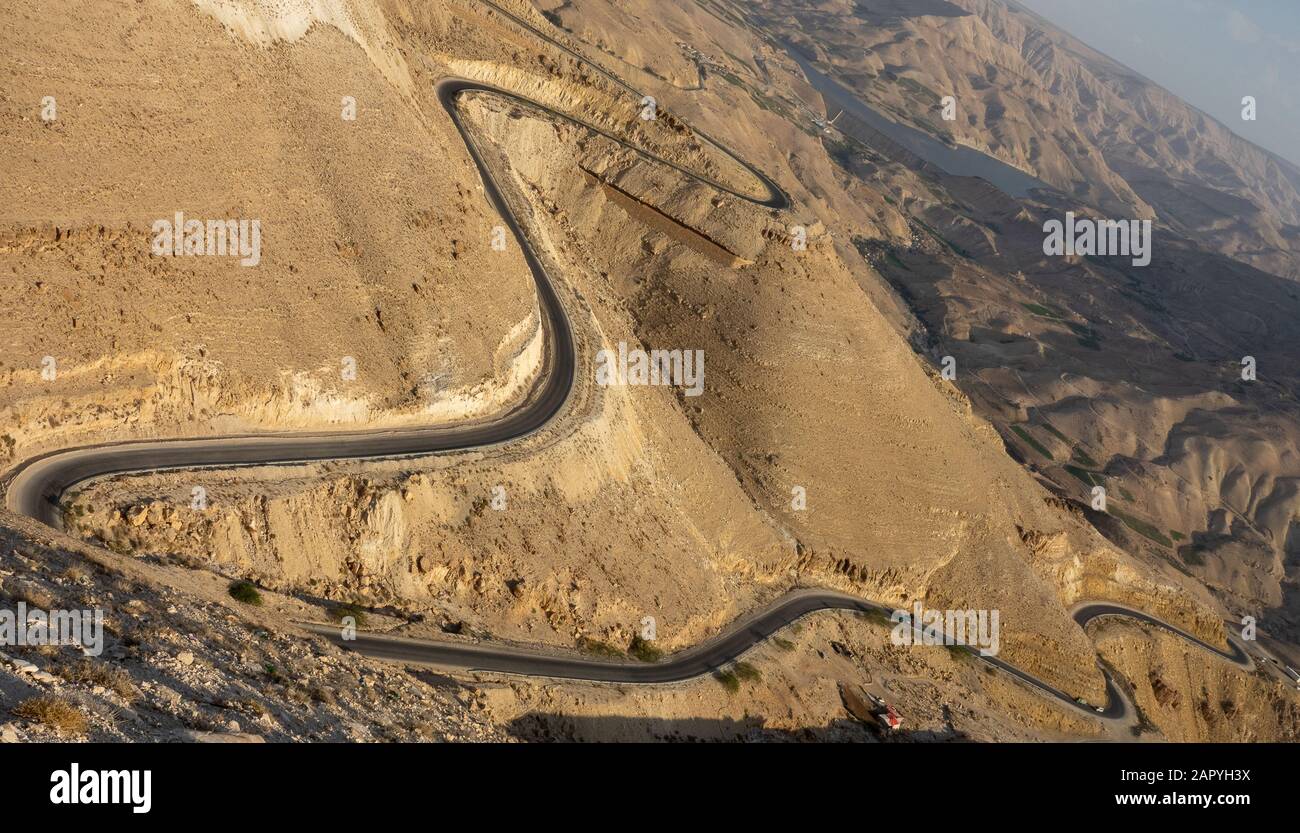 Road going over a mountain of sand during daytime Stock Photo - Alamy