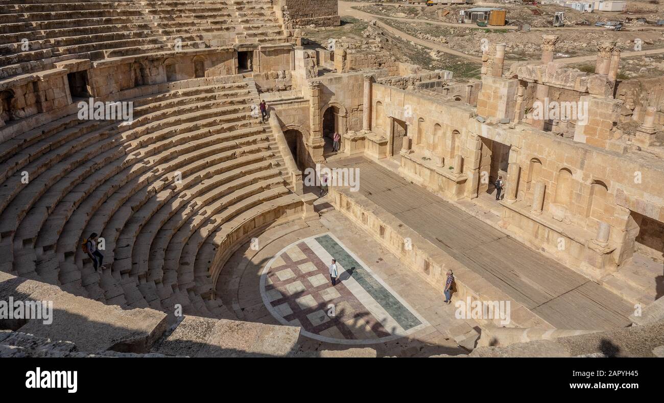 High angle shot of two people standing in an ancient amphitheater ...