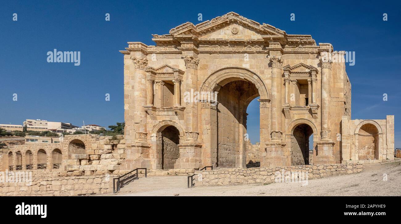 Wide angle shot of the Arch of Hadrian in Jordan under a blue sky Stock ...