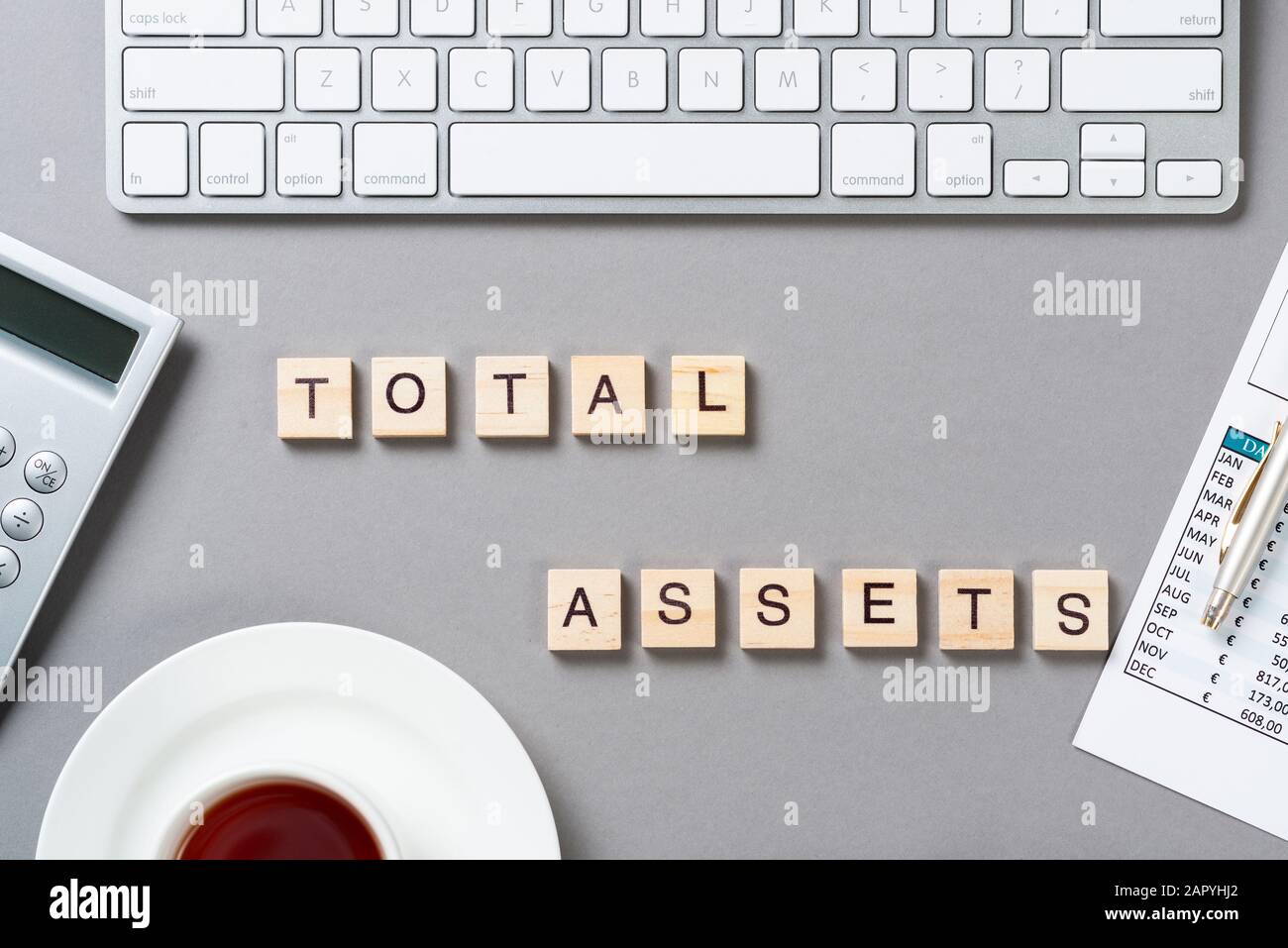 Total assets concept with letters on cubes Stock Photo - Alamy