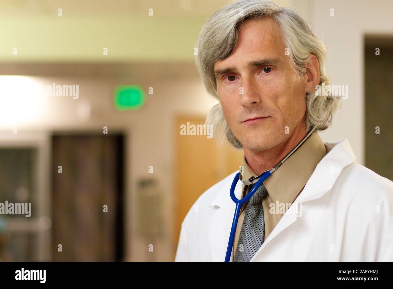 Portrait of a man doctor with a Stethoscope under the lights against a ...