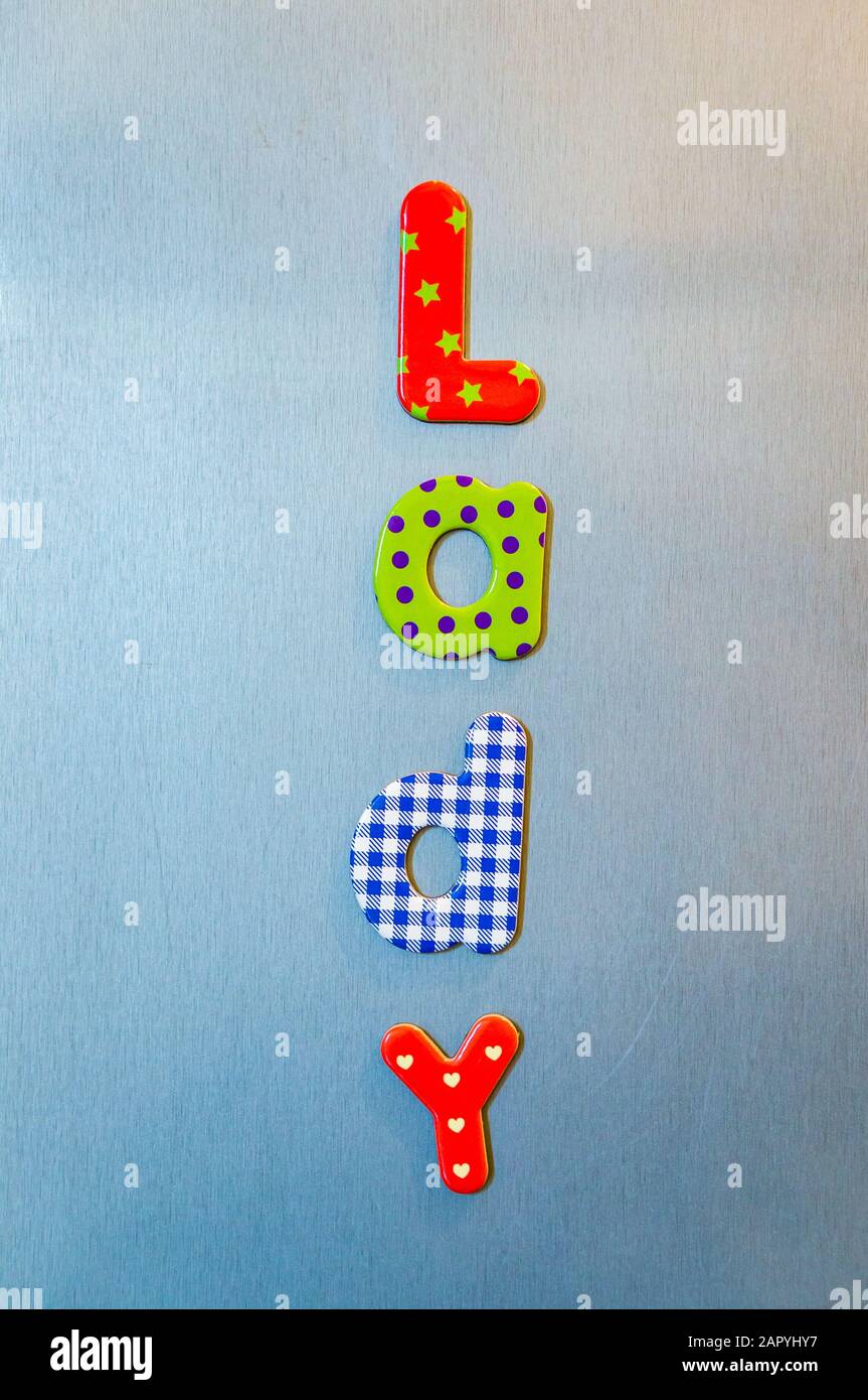 Vertical shot of colorful words spelling out lady in a line Stock Photo ...