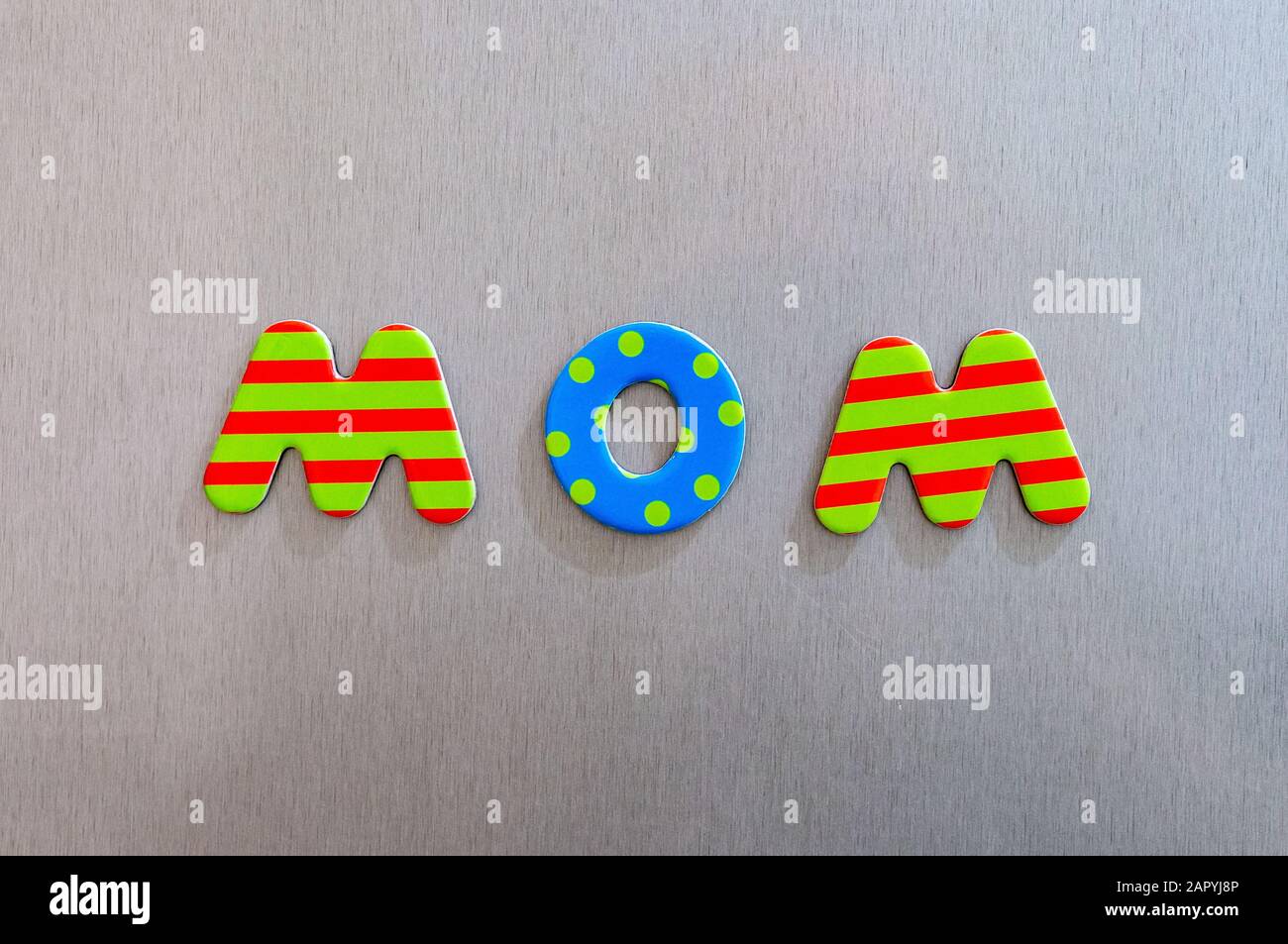 Closeup shot of colorful words spelling mom Stock Photo - Alamy