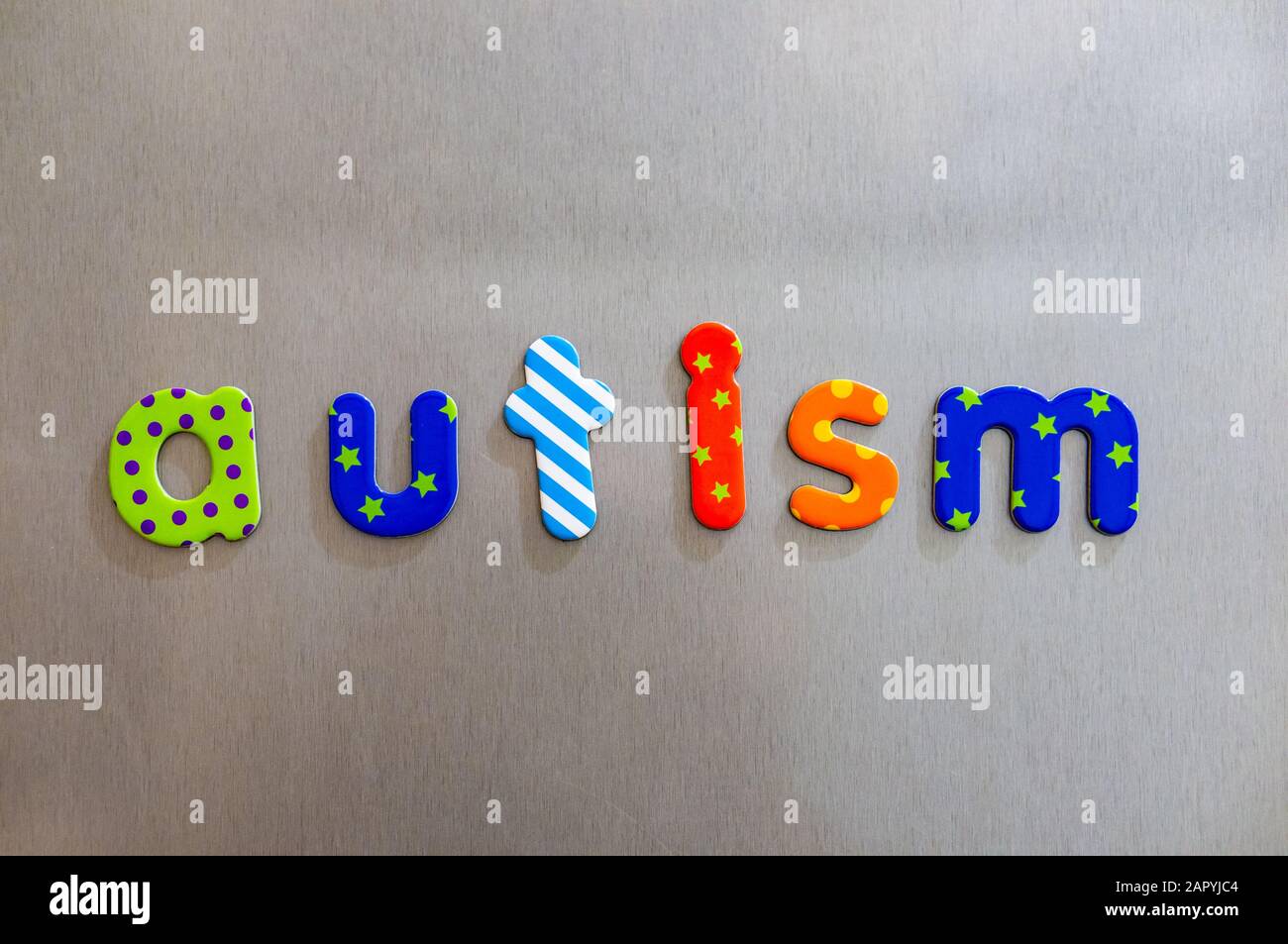 Closeup shot of colorful words spelling out autism Stock Photo - Alamy