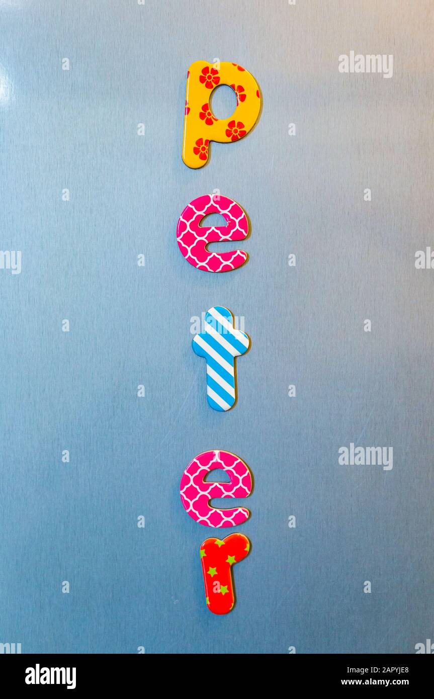 Vertical shot of colorful words spelling out peter Stock Photo - Alamy