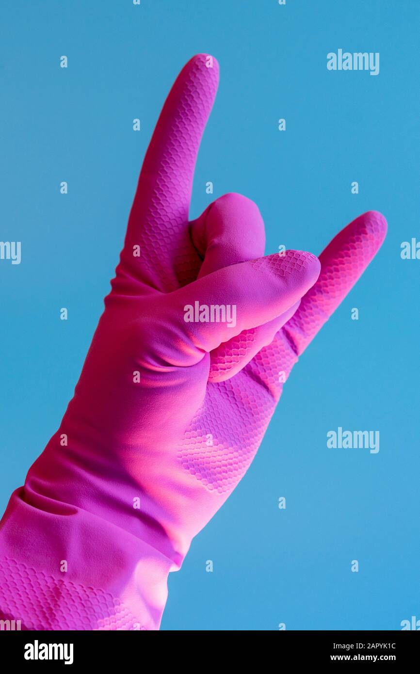 Hand with cleaning glove making fist. vertical photo Stock Photo - Alamy