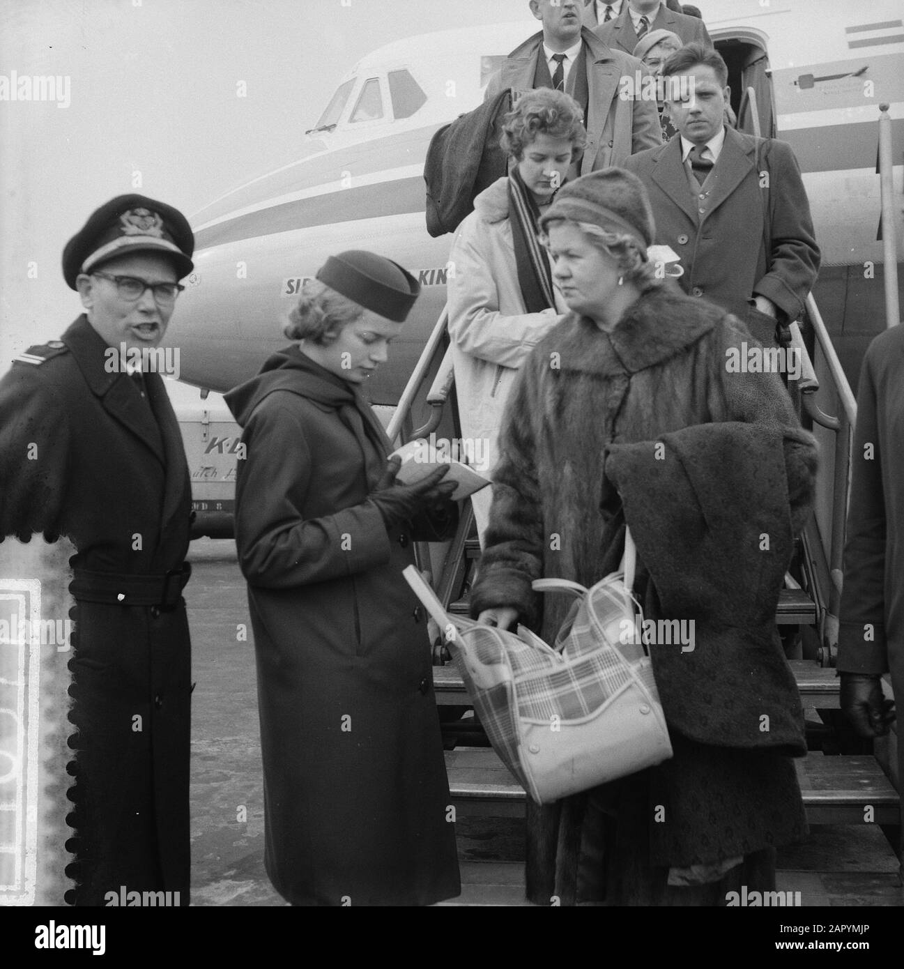 Stewardessen helpful in getting off the passagi Date: February 29, 1960 ...