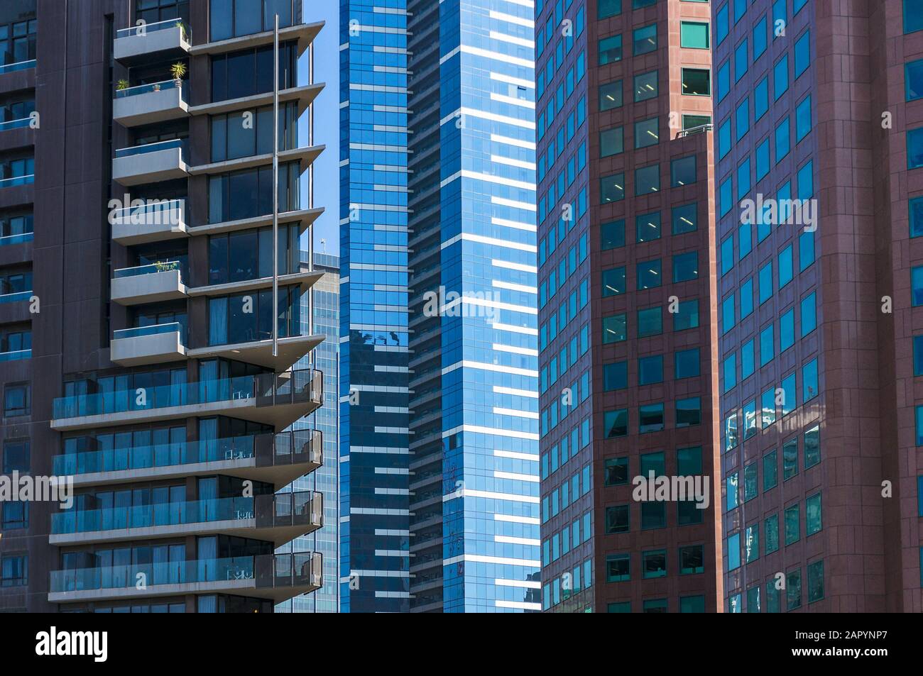 Architecture background of modern buildings standing close to each ...